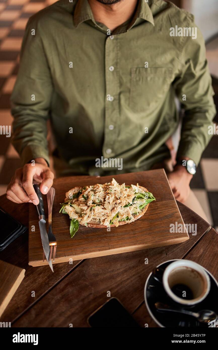 Man holding fork and knife hi-res stock photography and images - Alamy