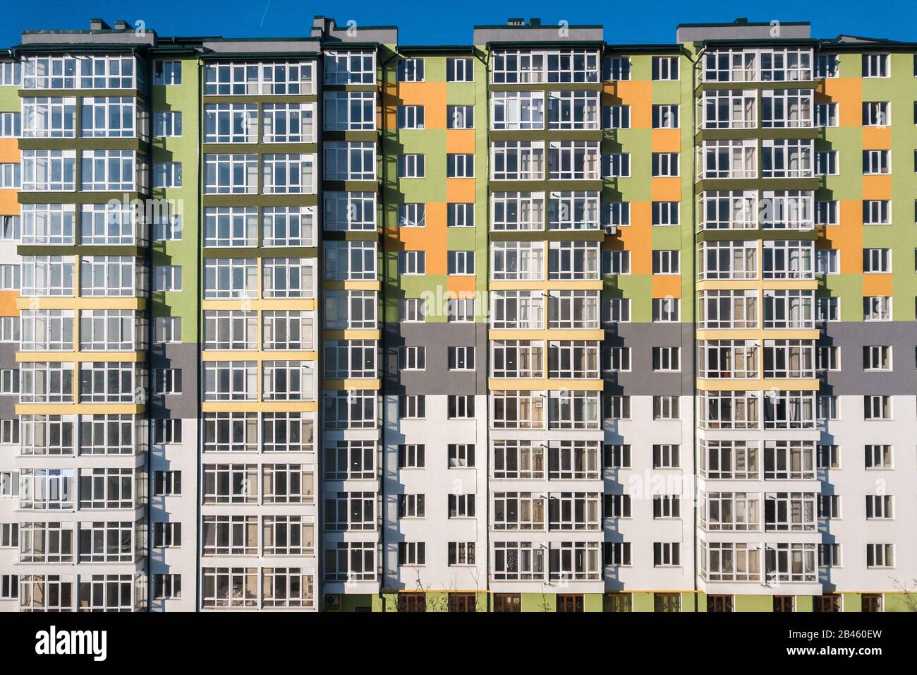 Aerial view of a tall residential apartment building with many windows ...