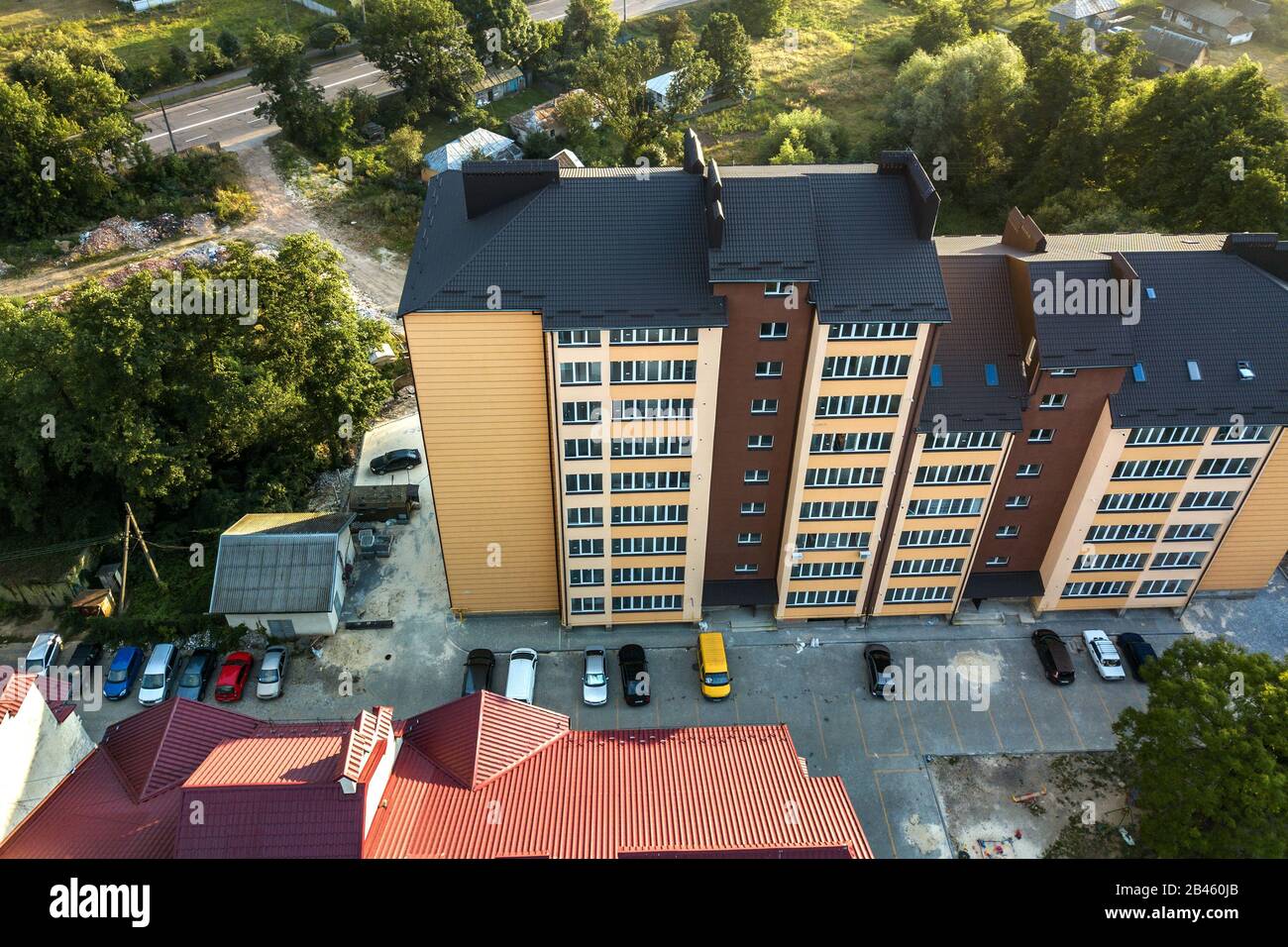 Aerial view of multistory apartment buildings in green residential area ...
