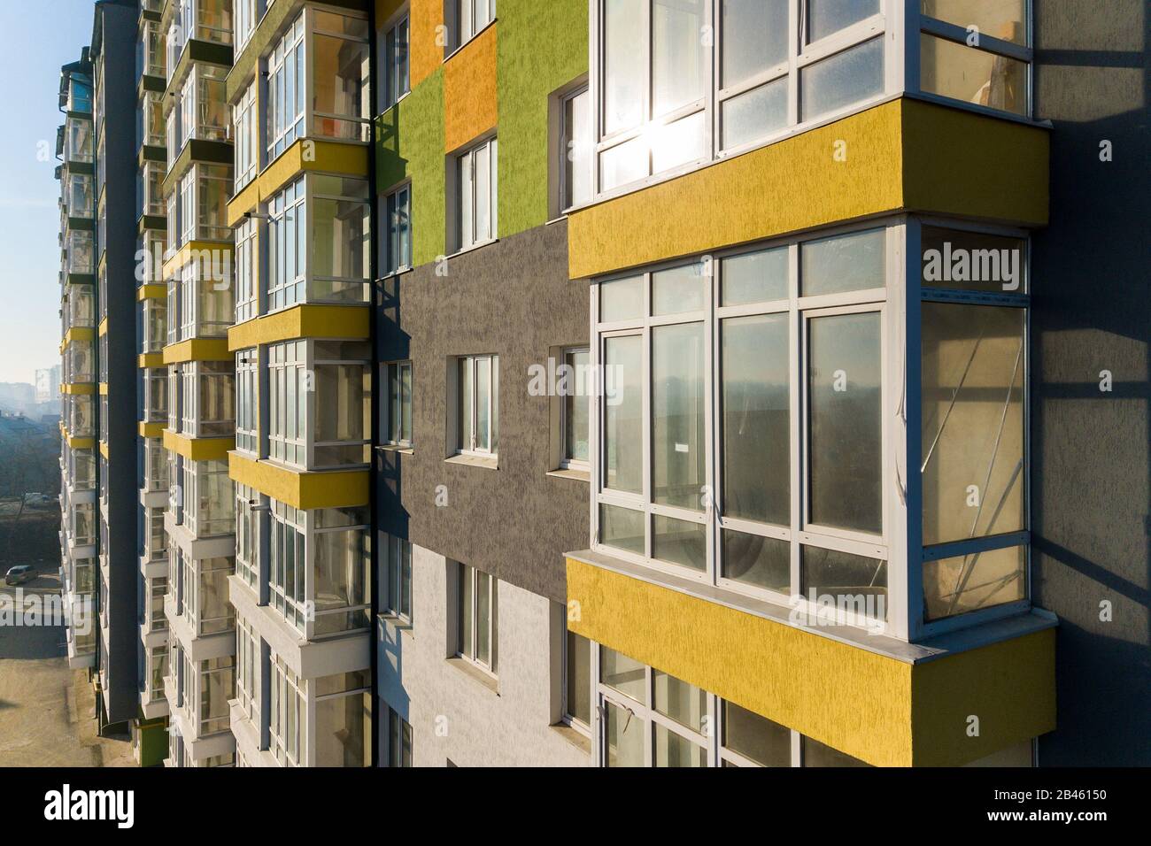 Aerial view of a tall residential apartment building with many windows ...