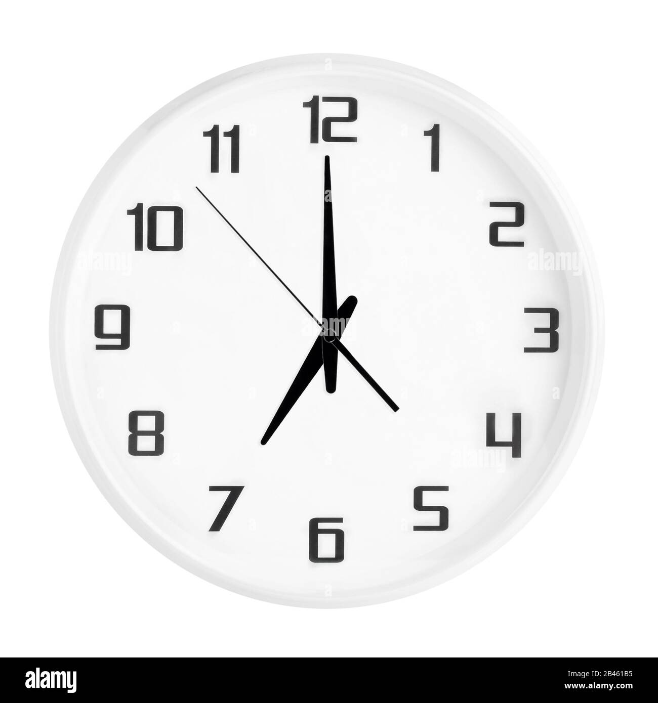 White round office clock showing seven o'clock isolated on white ...