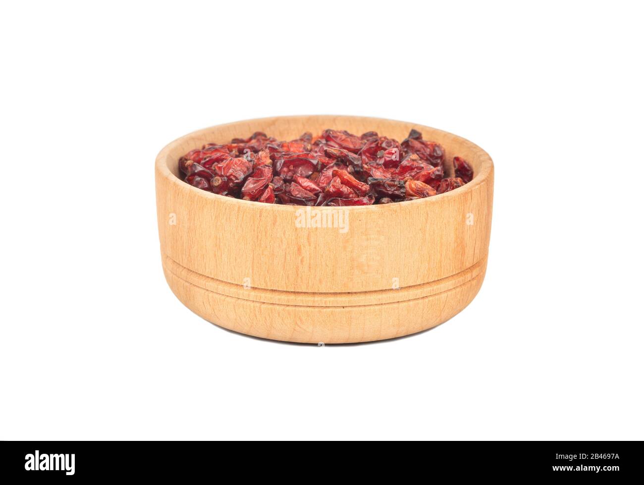 Dry barberry in wooden bowl on white background Stock Photo - Alamy