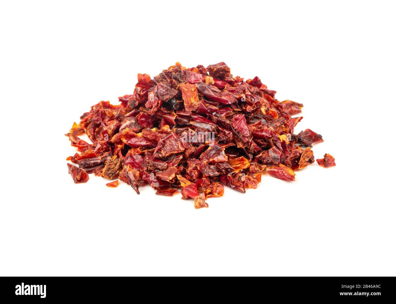 Pile of pieces of dry red pepper on a white background Stock Photo - Alamy