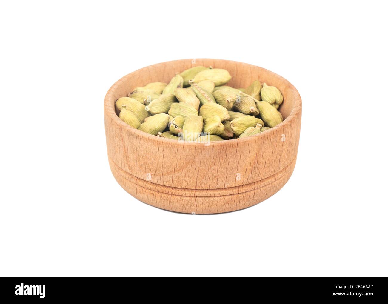 Dry cardamom in wooden bowl isolated on white background Stock Photo ...