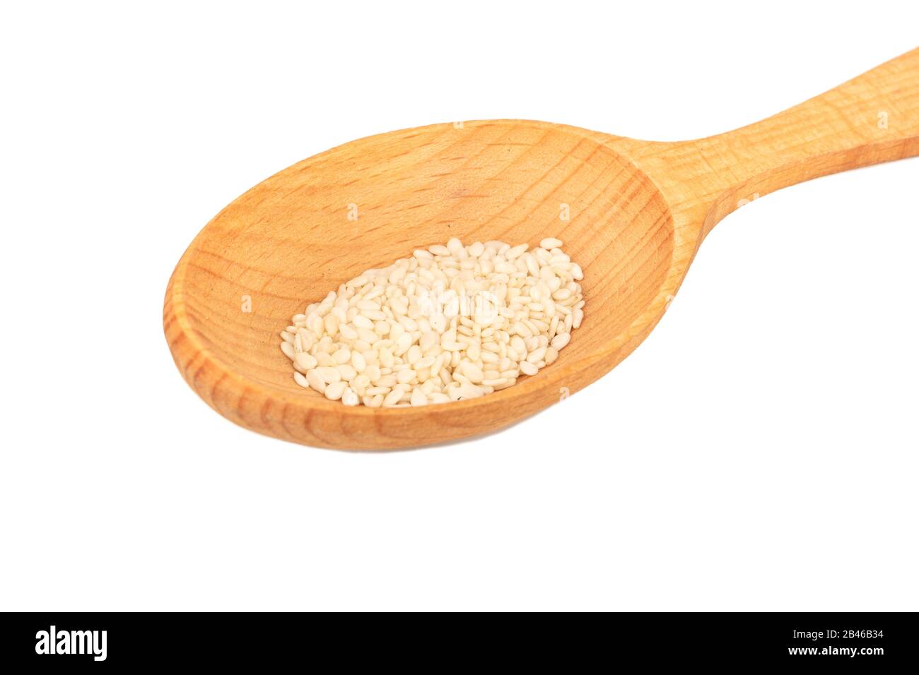 Large spoon with sesame seeds isolated on white background Stock Photo ...