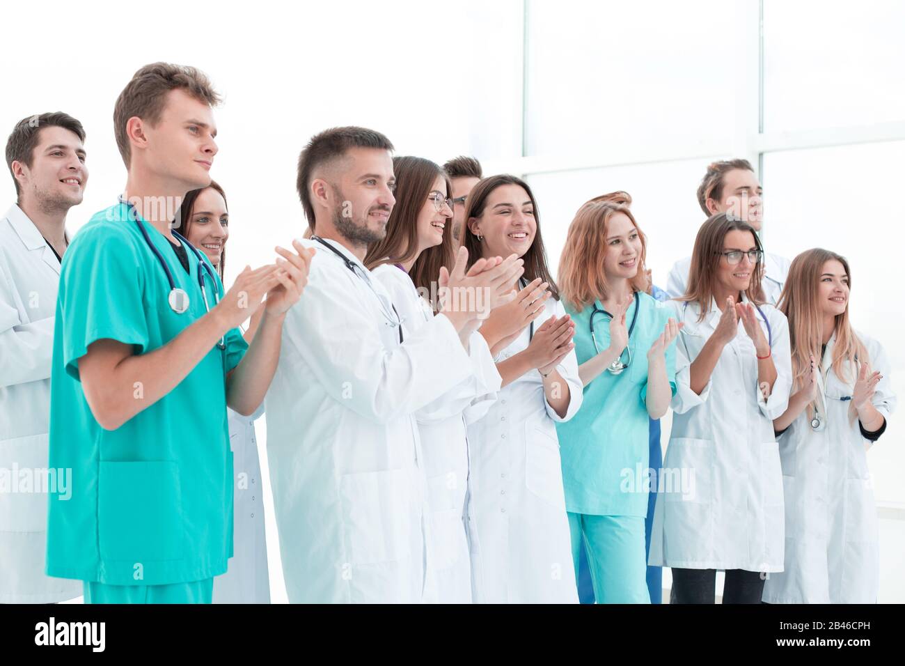 top view. a group of smiling doctors pointing at you Stock Photo - Alamy