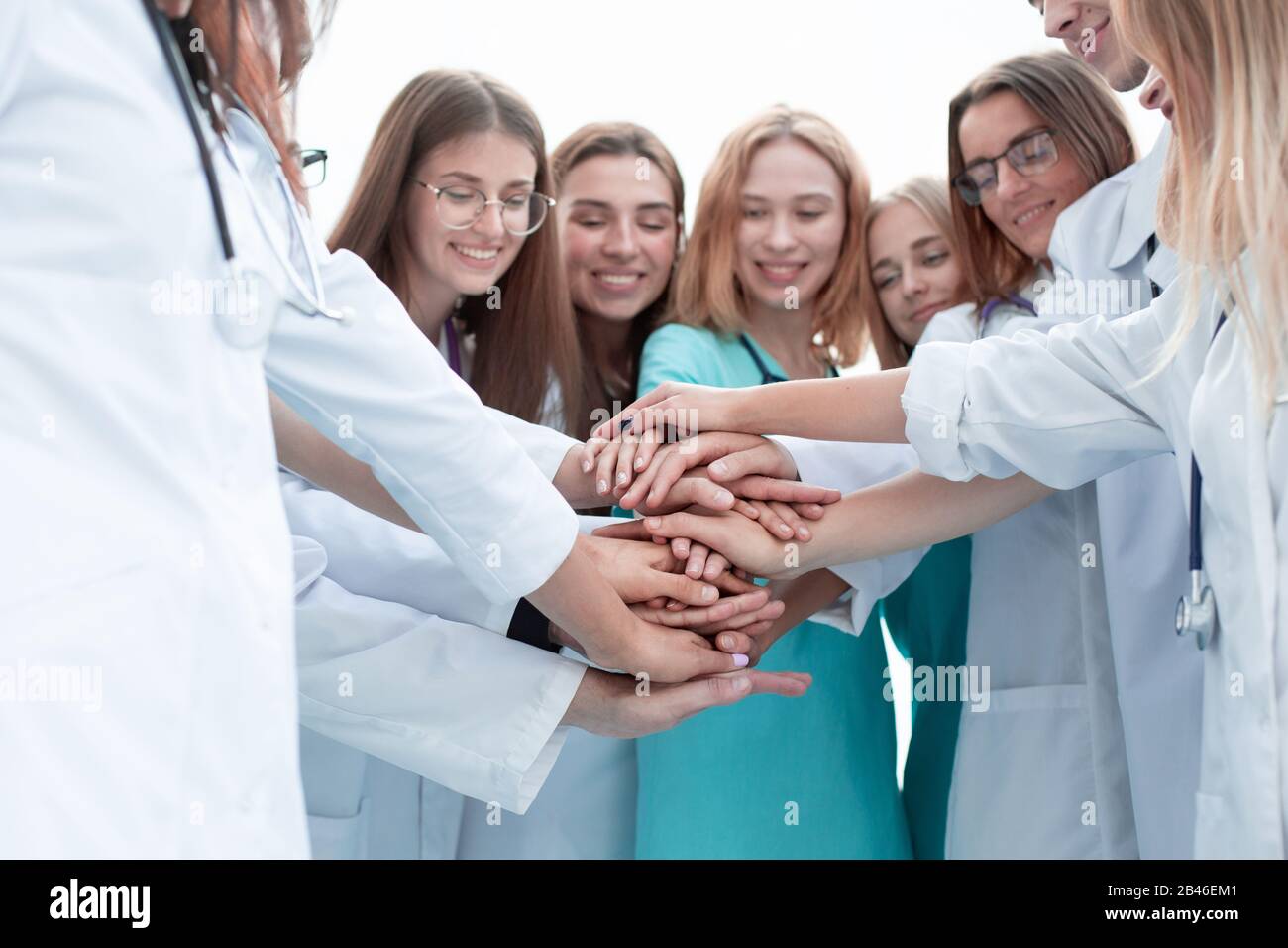 top view. a group of smiling doctors pointing at you Stock Photo - Alamy