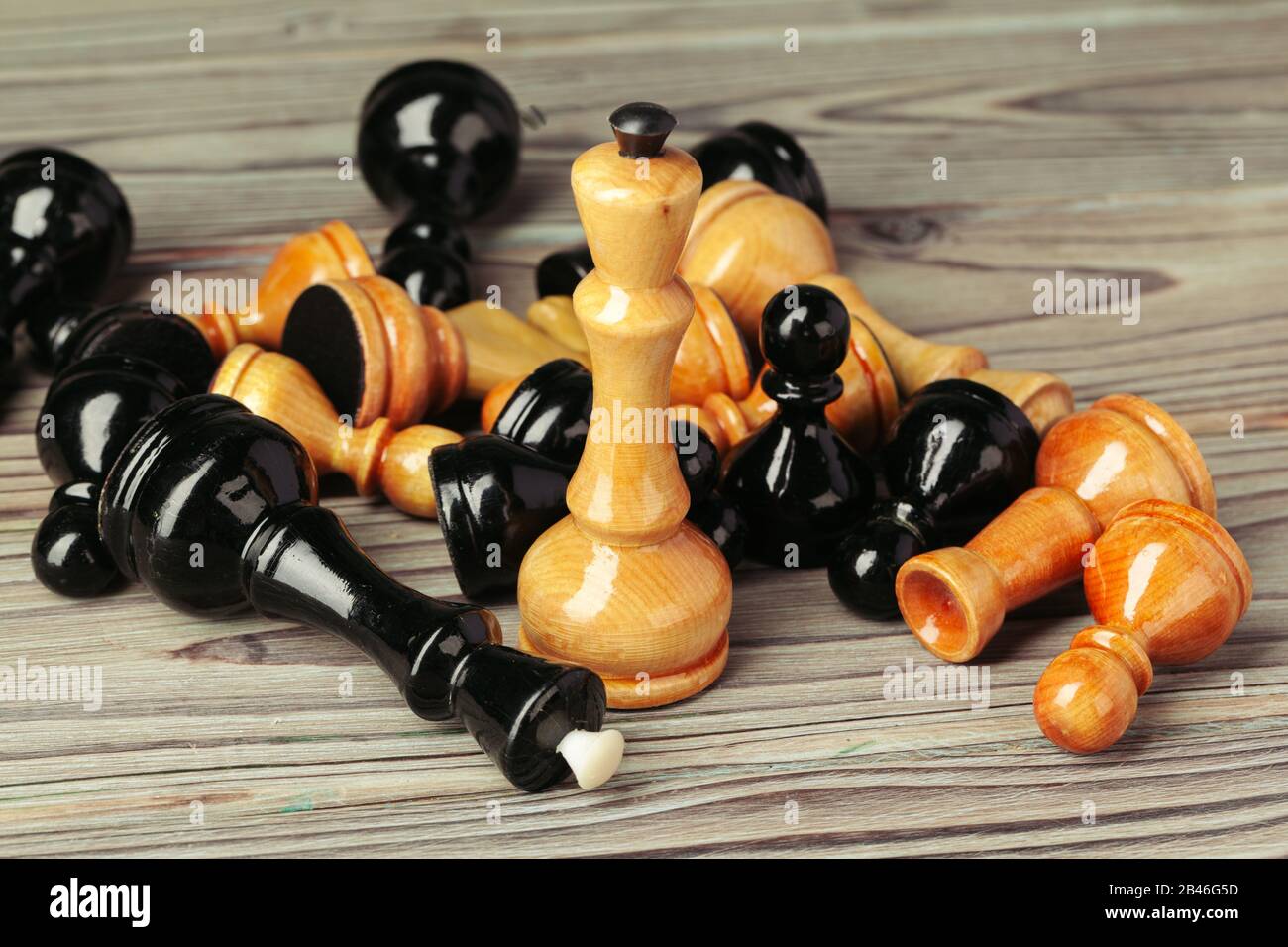 chess figures on brown woden table background Stock Photo - Alamy