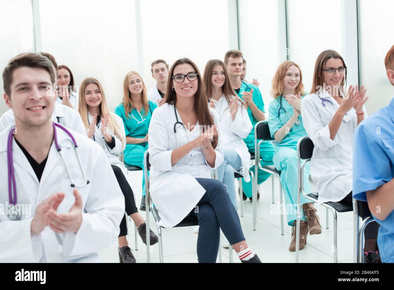top view. a group of smiling doctors pointing at you Stock Photo - Alamy