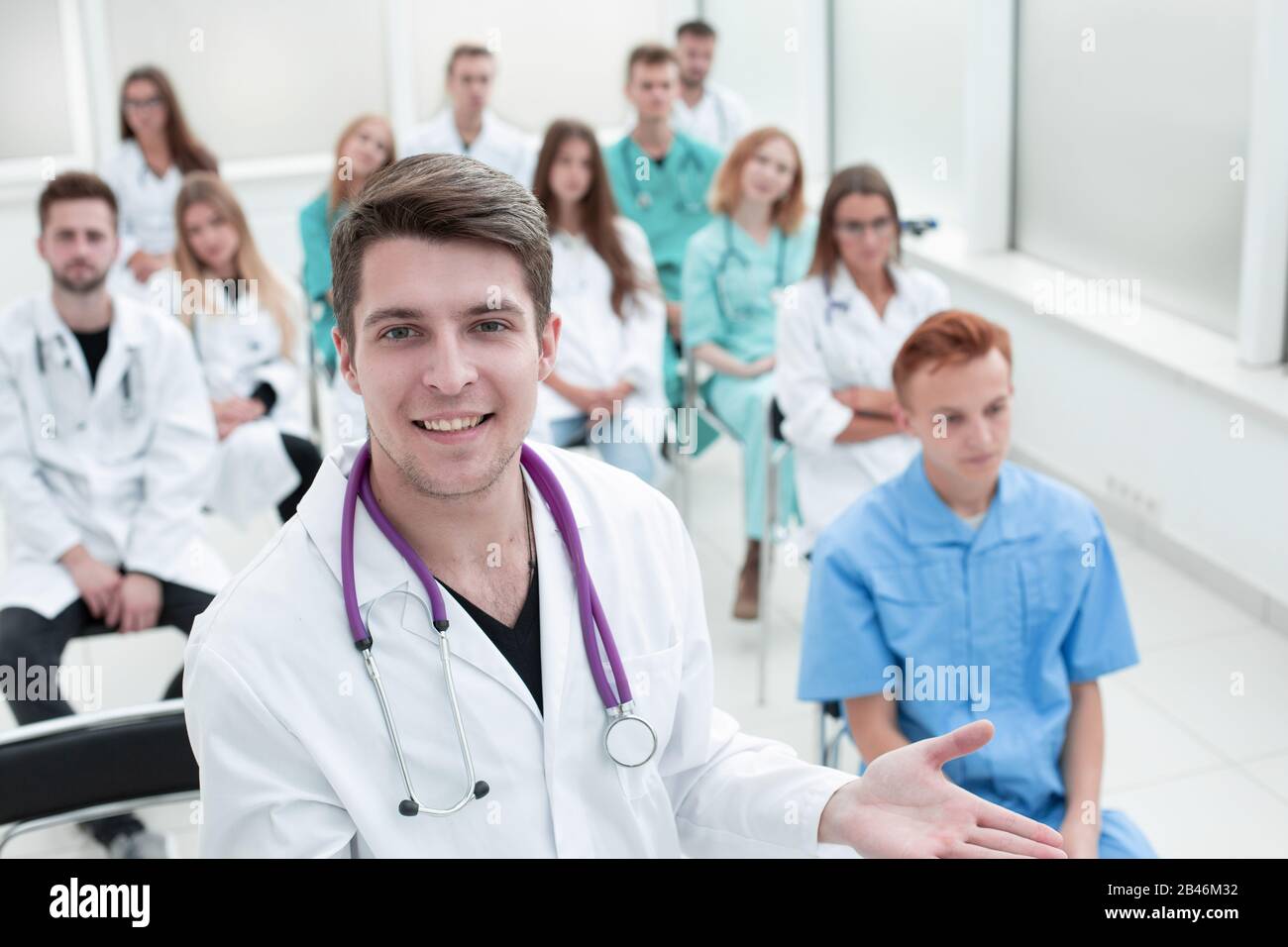 top view. a group of smiling doctors pointing at you Stock Photo - Alamy