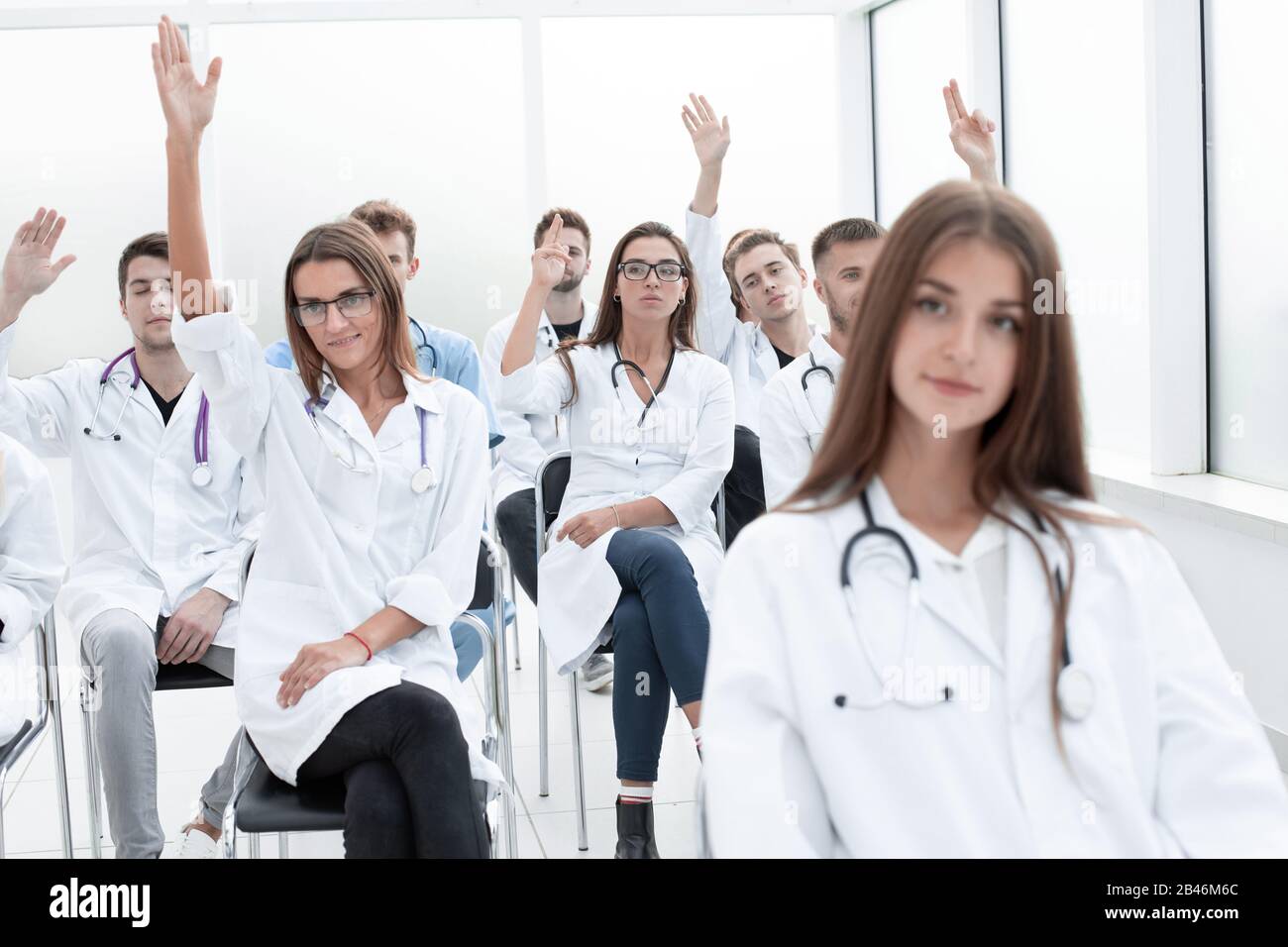 top view. a group of smiling doctors pointing at you Stock Photo - Alamy