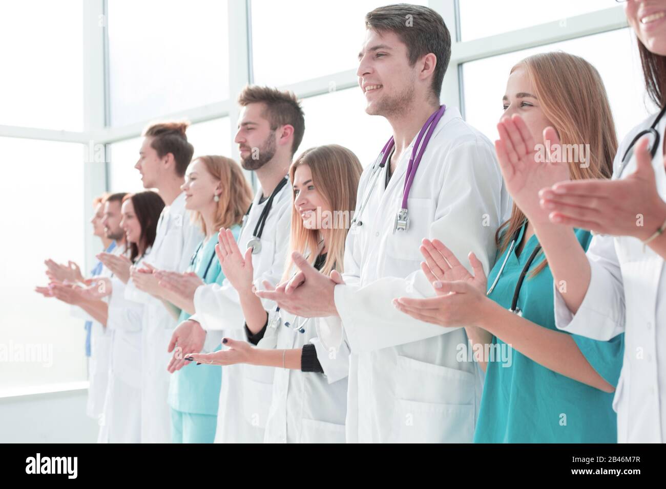 top view. a group of smiling doctors pointing at you Stock Photo - Alamy