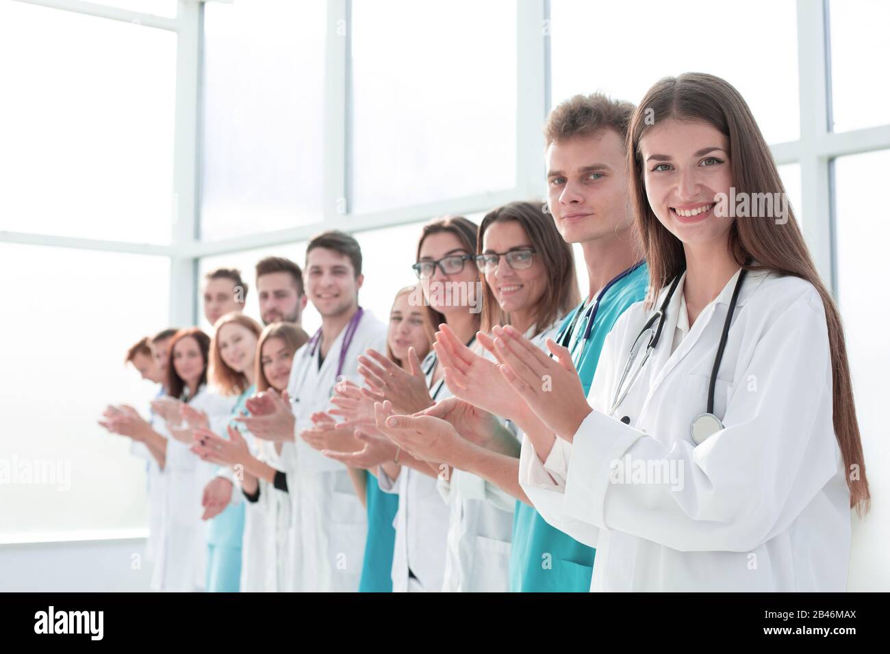 top view. a group of smiling doctors pointing at you Stock Photo - Alamy