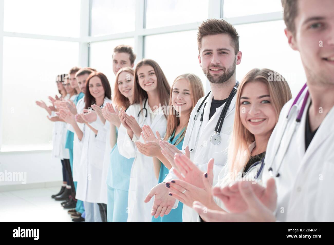 top view. a group of smiling doctors pointing at you Stock Photo - Alamy