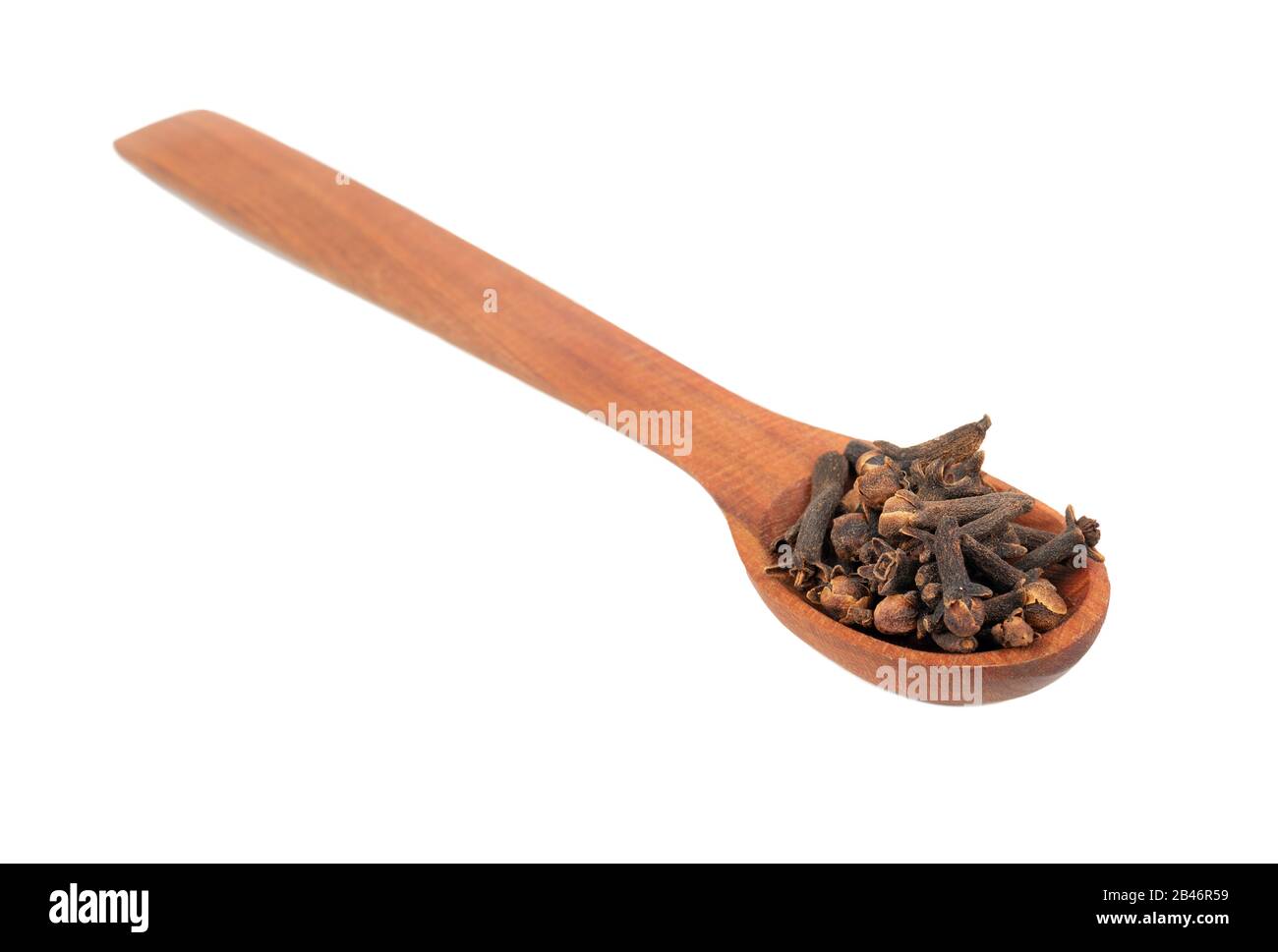 Whole cloves in wooden spoon hi-res stock photography and images - Alamy