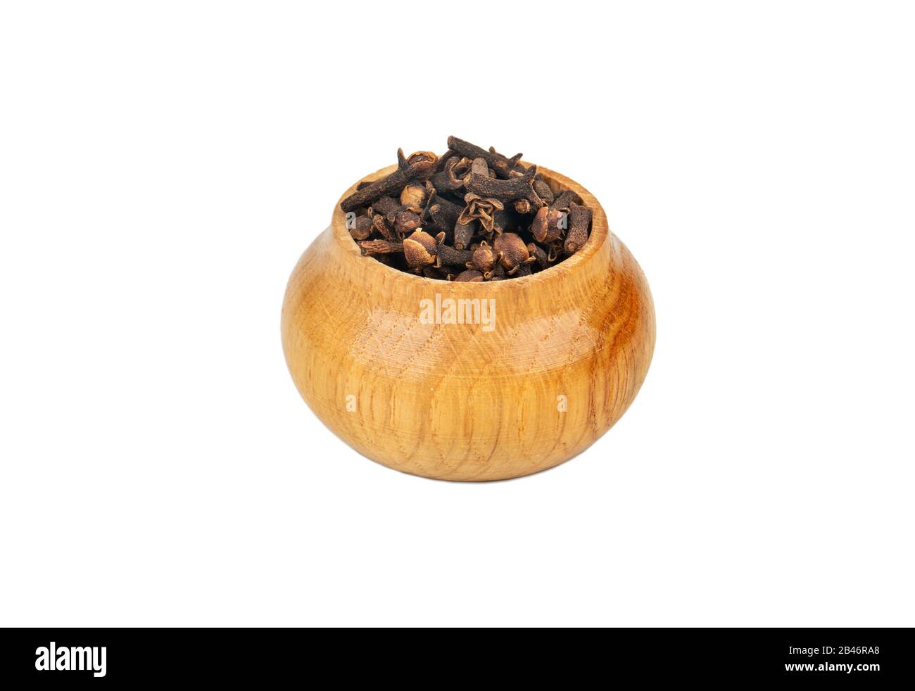 Spice dry cloves in wooden container isolated on white background Stock ...