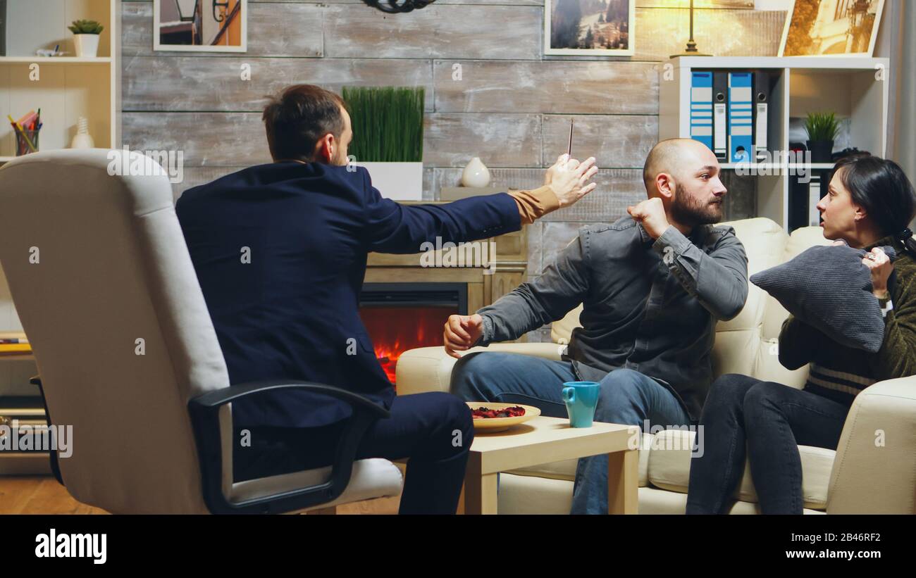 Psychologist stopping mad man to hit his wife while couple therapy ...