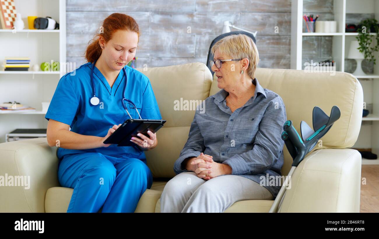 Female nuse helping senior hi-res stock photography and images - Alamy