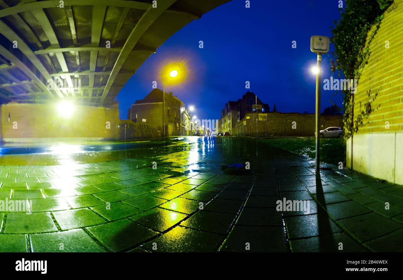 view on an empty street at night on a rainy winter day Stock Photo - Alamy