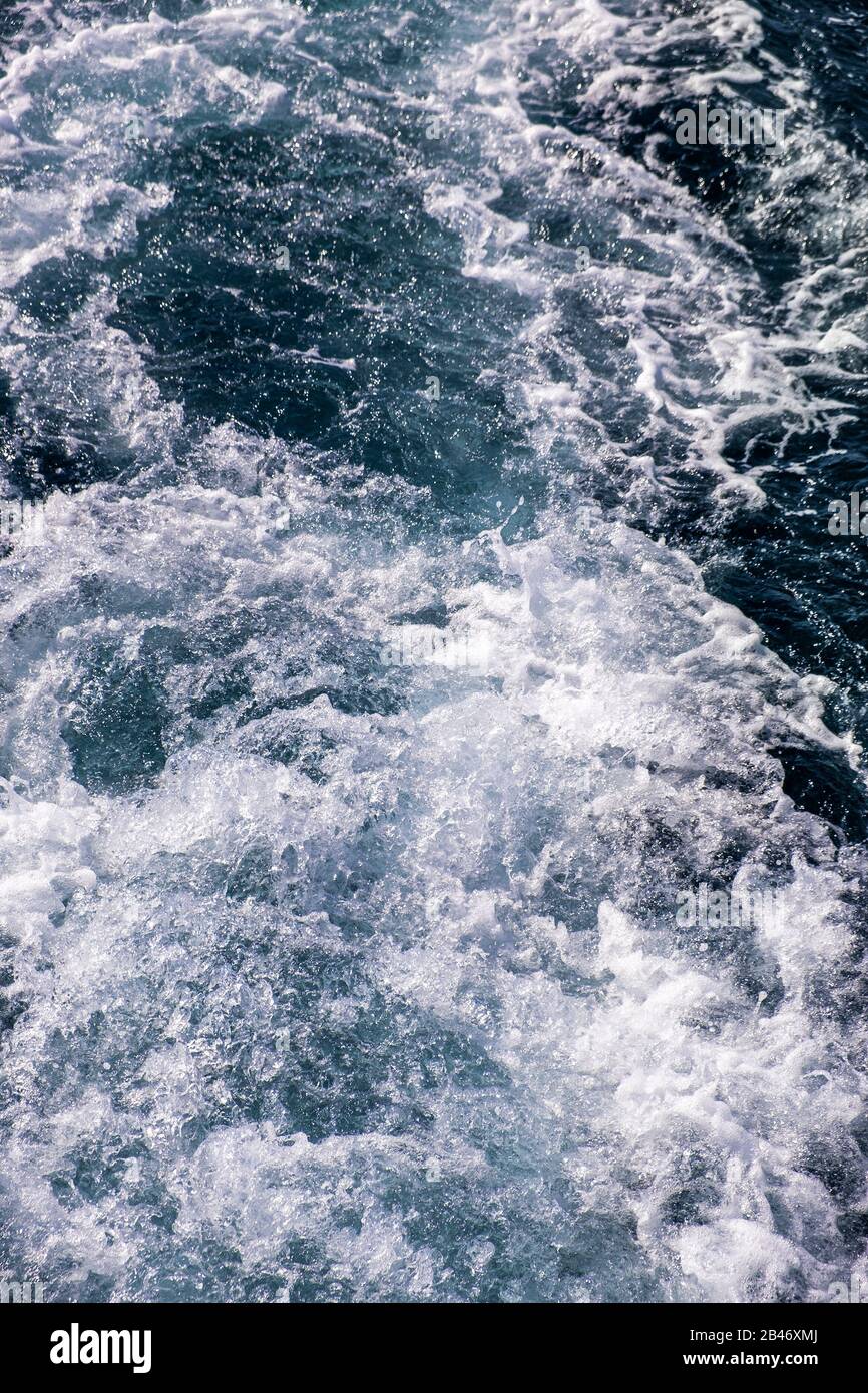 Top down aerial view of sea water surface. White foam waves texture as ...