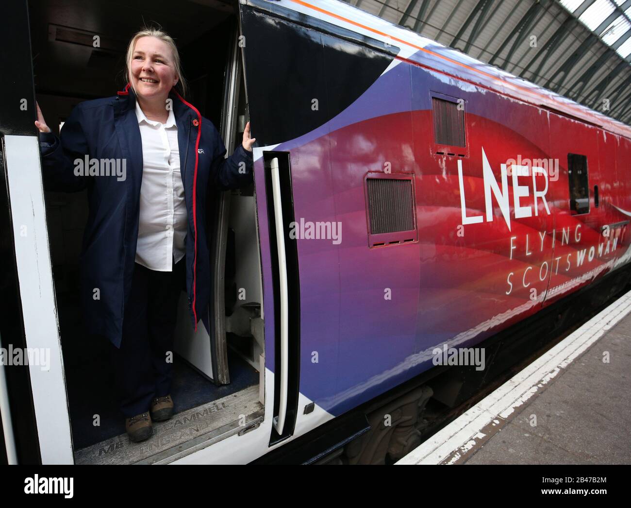 Driver Mel Tate exits the driver's car following the arrival of the all ...