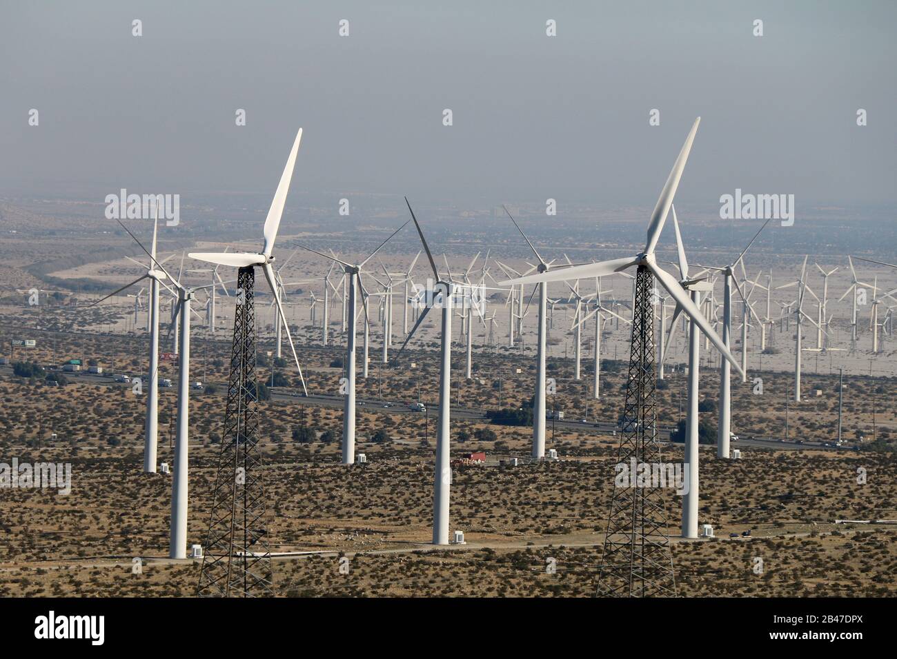 a distance view of a huge wind farm in a western desert Stock Photo - Alamy