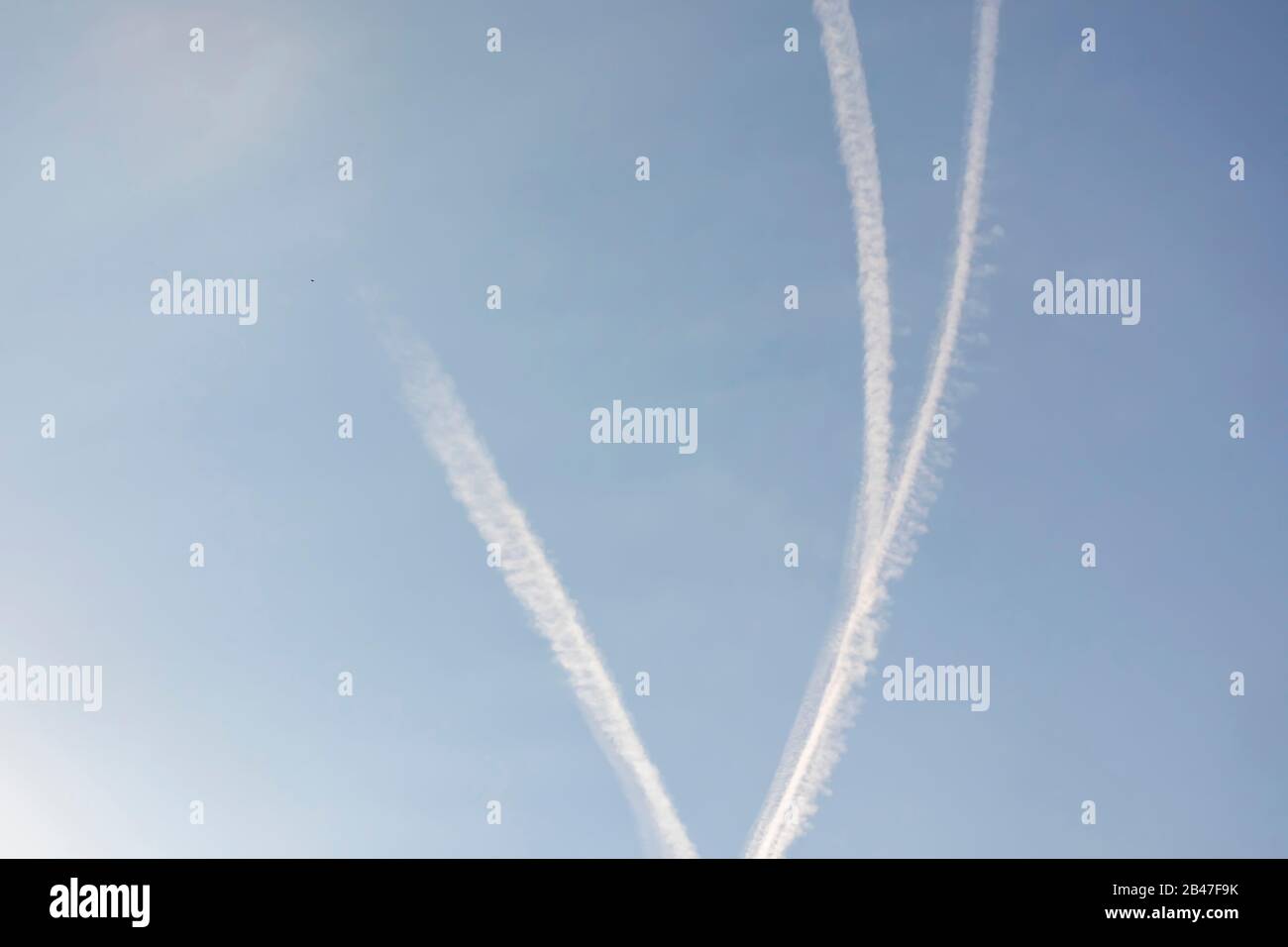 jet fuel trail left by planes at the blue sky Stock Photo - Alamy