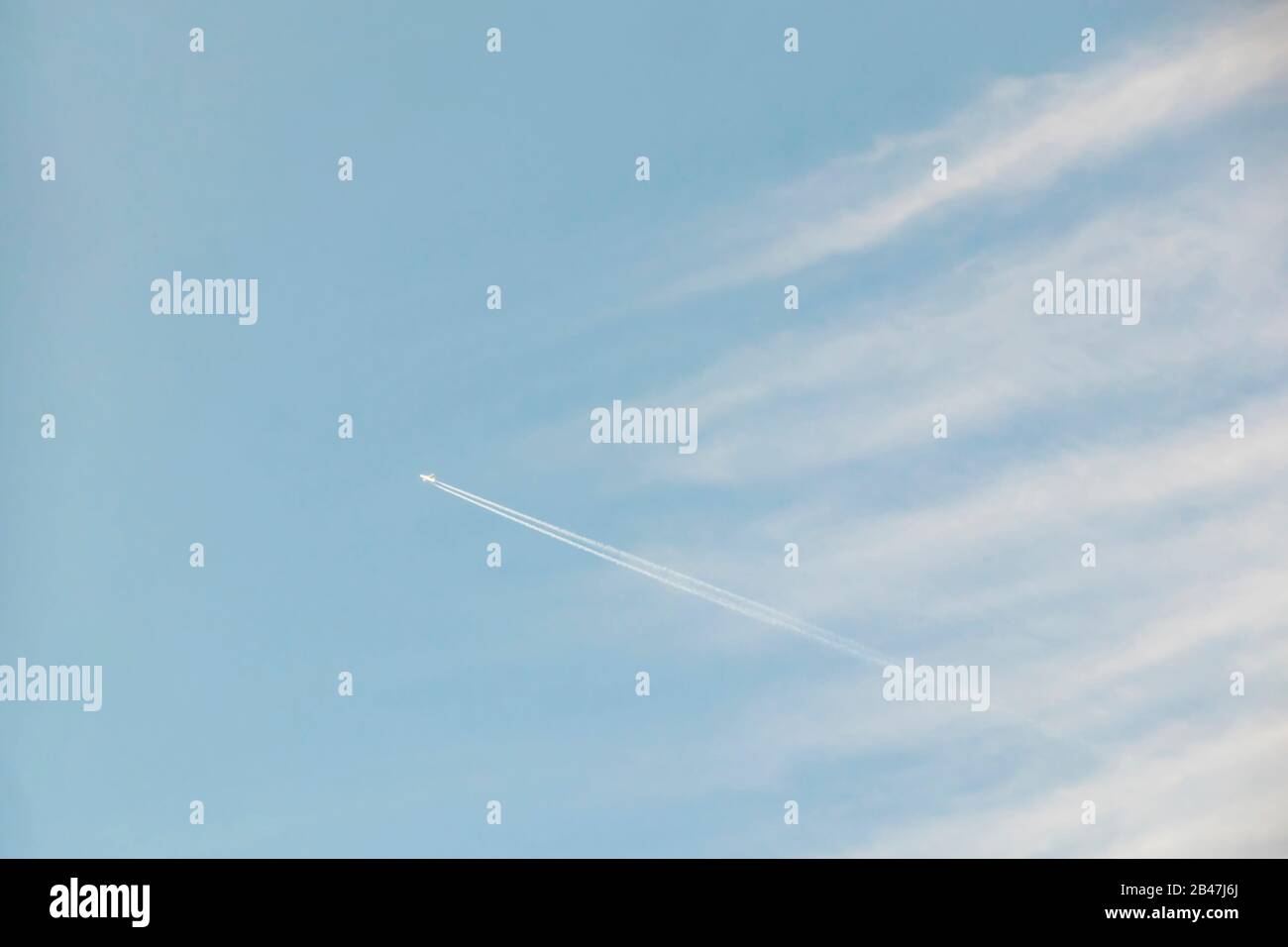 jet fuel trail left by planes at the blue sky Stock Photo - Alamy