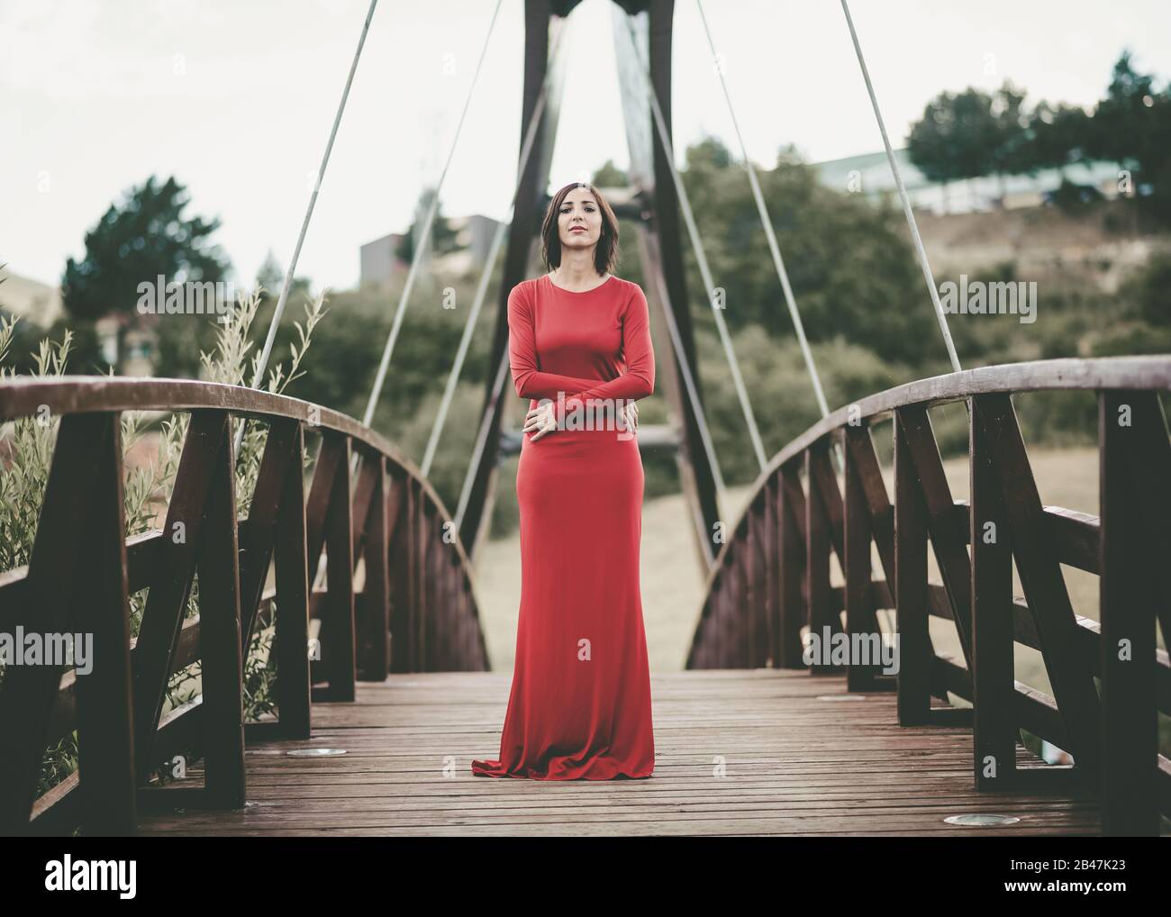 elegant young Woman on Bridge outdoor Stock Photo - Alamy