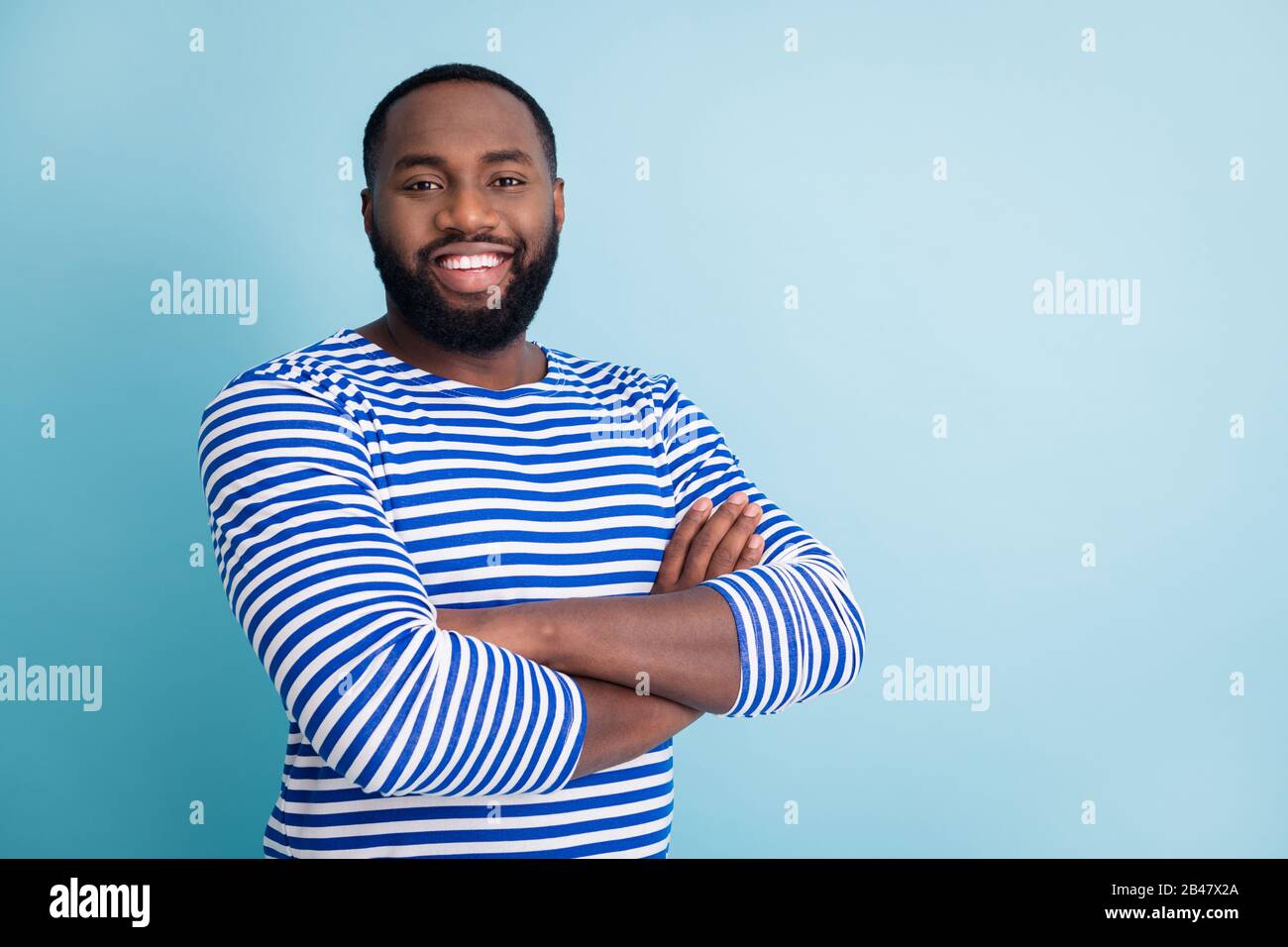 Turned photo of cheerful smart professional afro american guy sailor ...