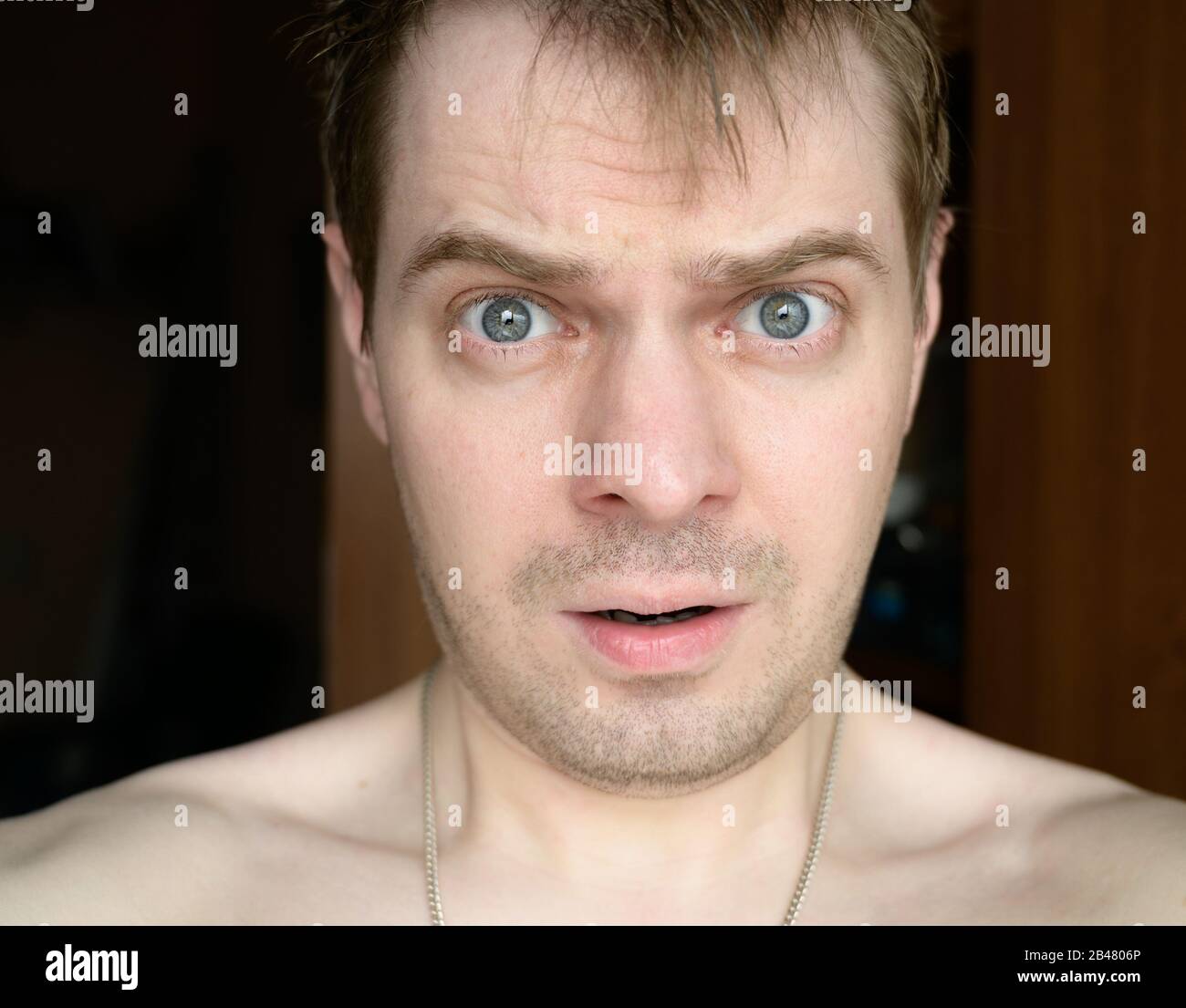 Portrait of a young man with surprised face Stock Photo - Alamy