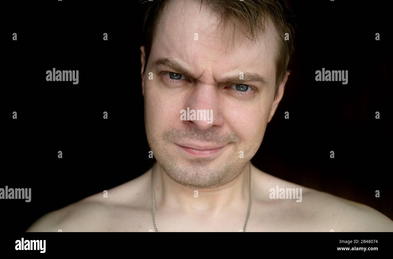 Portrait of a young man with surprised face Stock Photo - Alamy