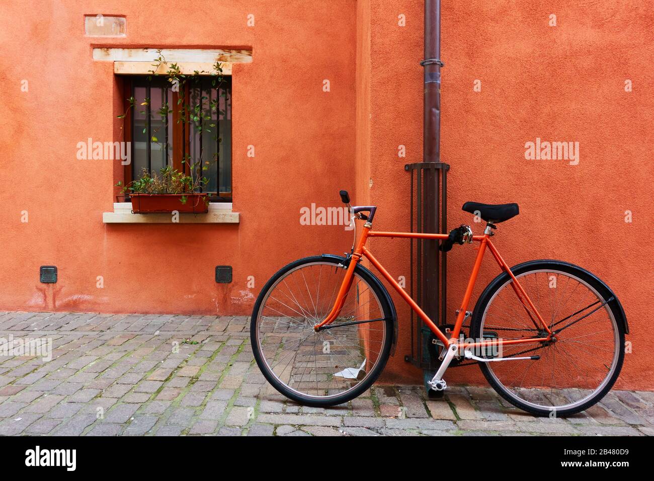 Red bicycle near old house in Rimini, Emilia-Romagna, Italy Stock Photo ...