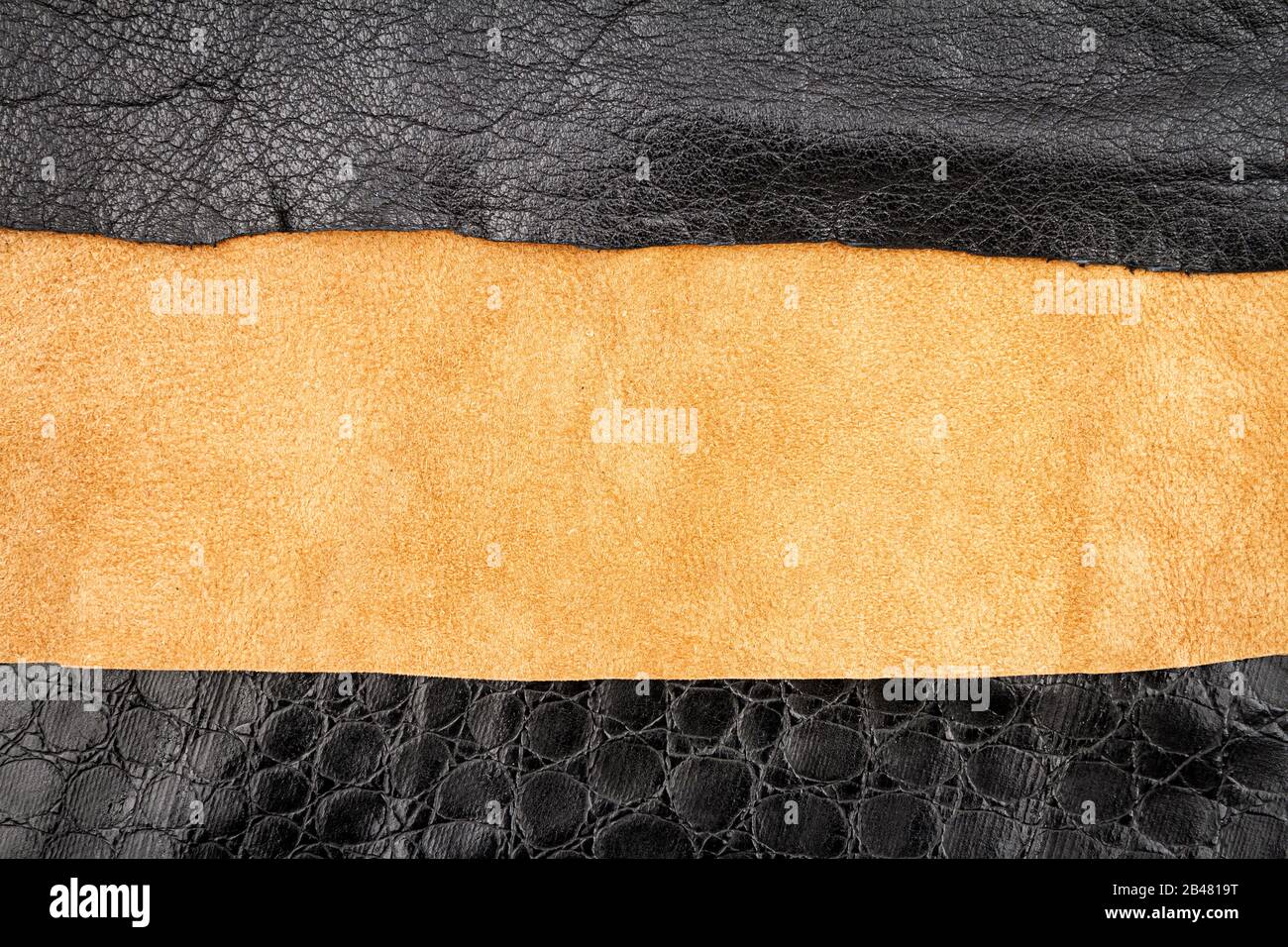 Brown and black leather and artificial alligator skin textures ...
