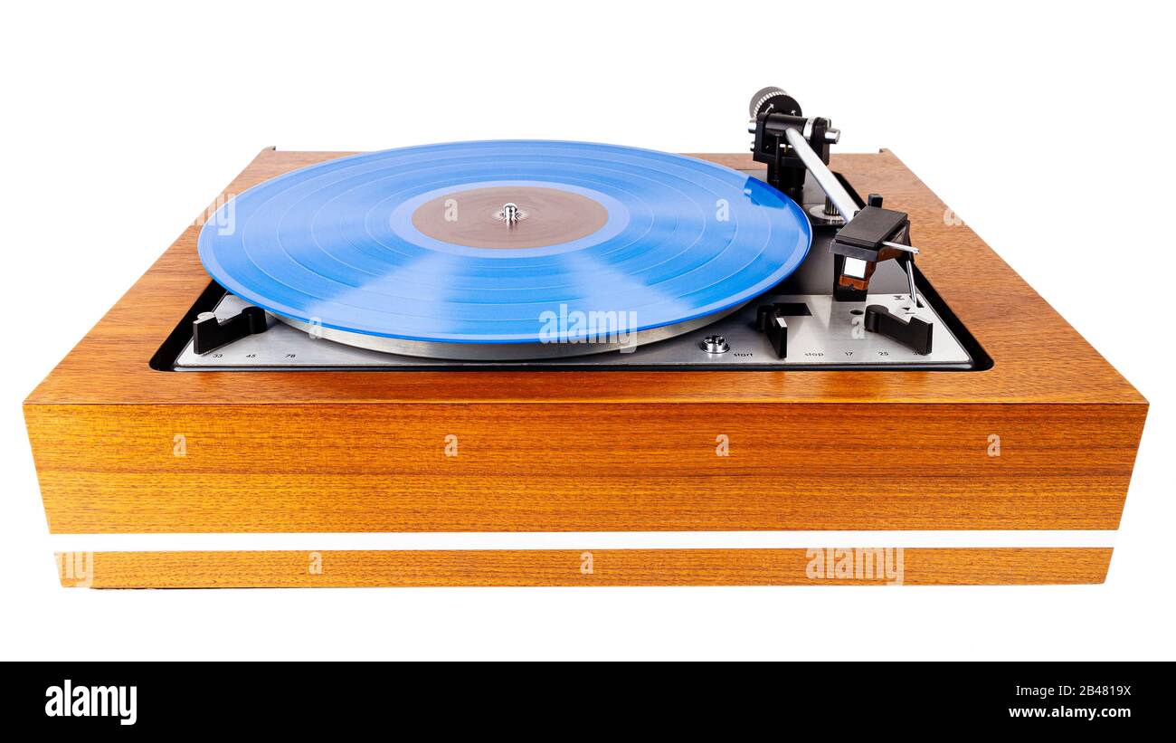 Vintage turntable with a blue vinyl isolated on white. Wooden plinth ...