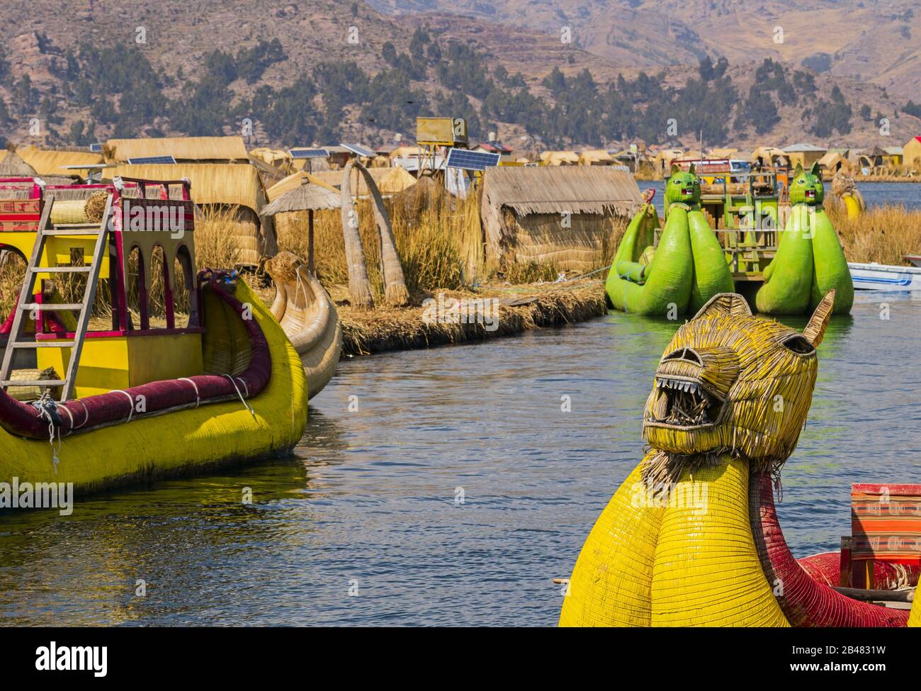 View of Uros floating islands with typical boats, Puno, Peru Stock ...