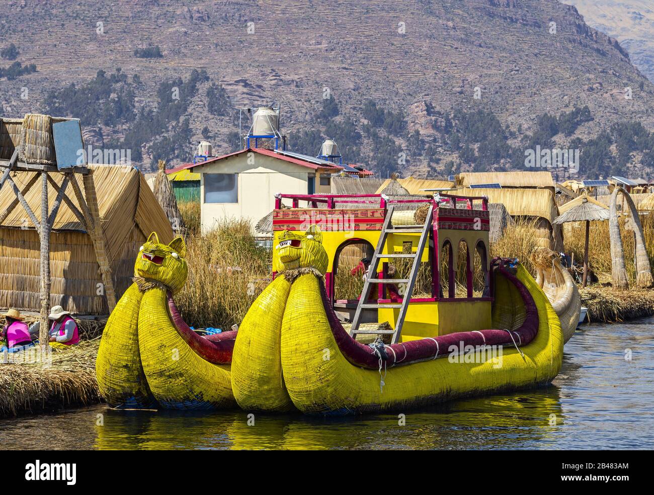 View of Uros floating islands with typical boats, Puno, Peru Stock ...