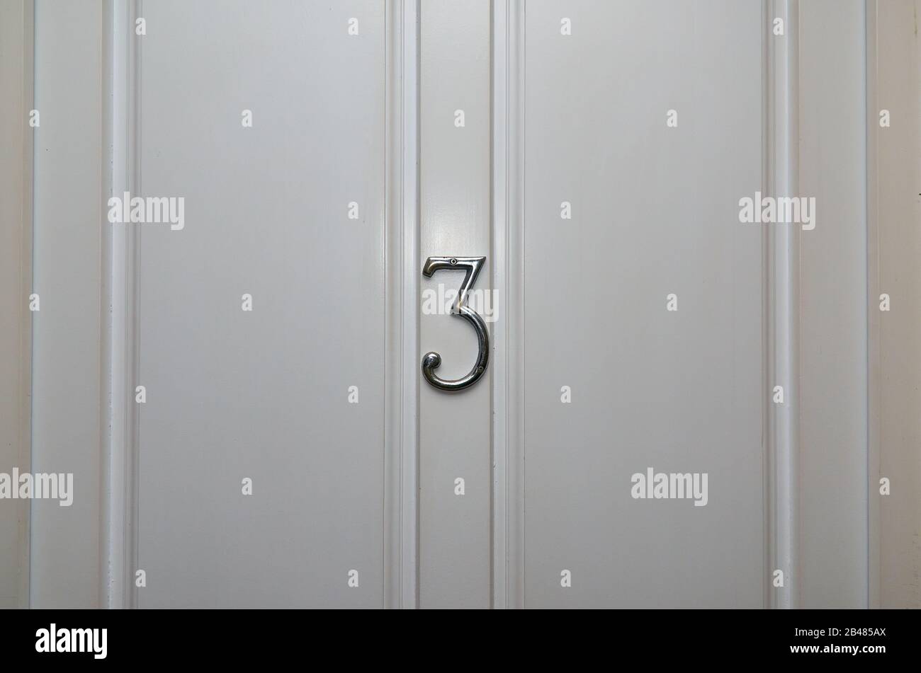 Door number 3, three - on a white wooden door Stock Photo - Alamy