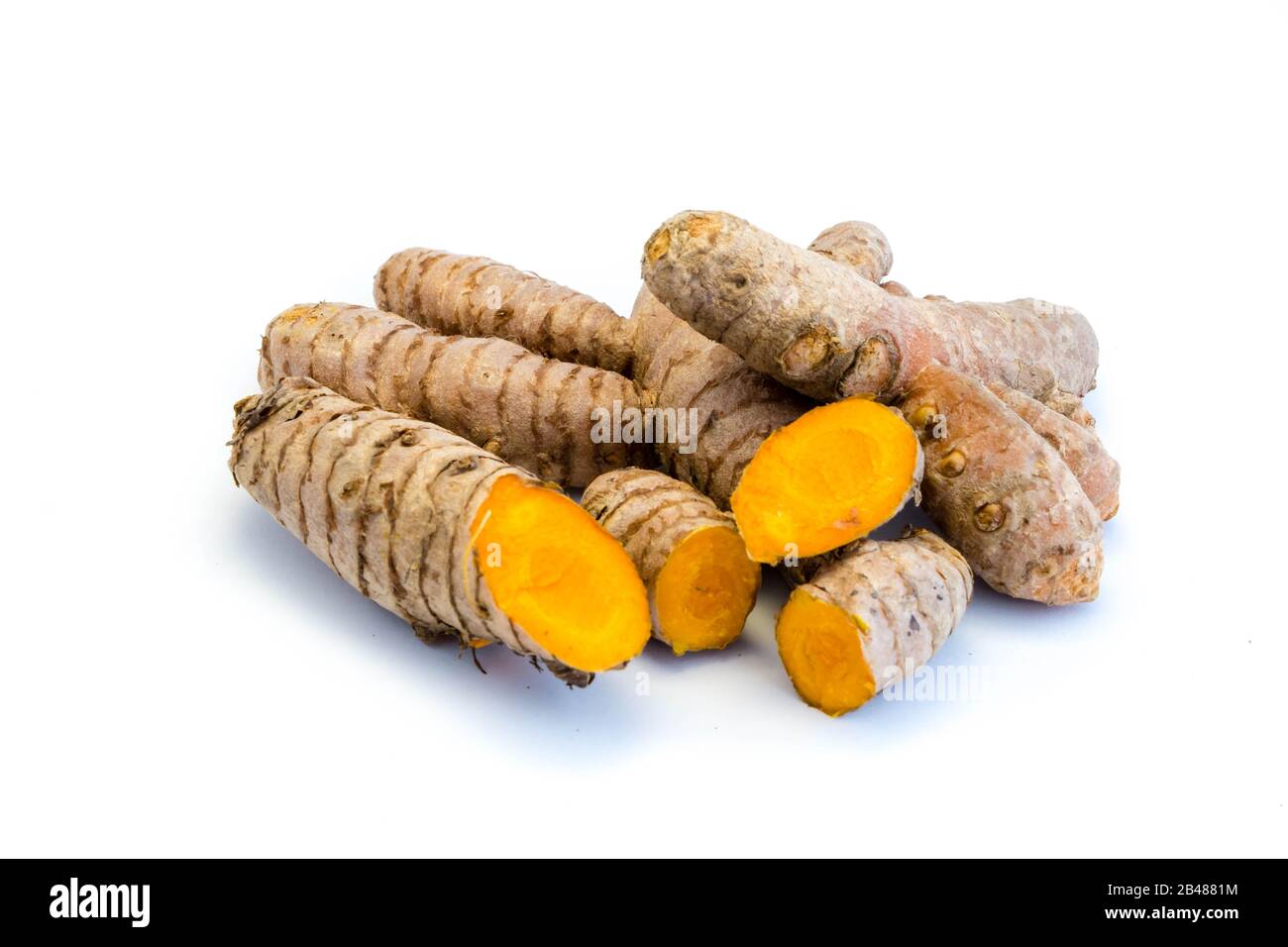 Turmeric root isolated on white background Stock Photo - Alamy