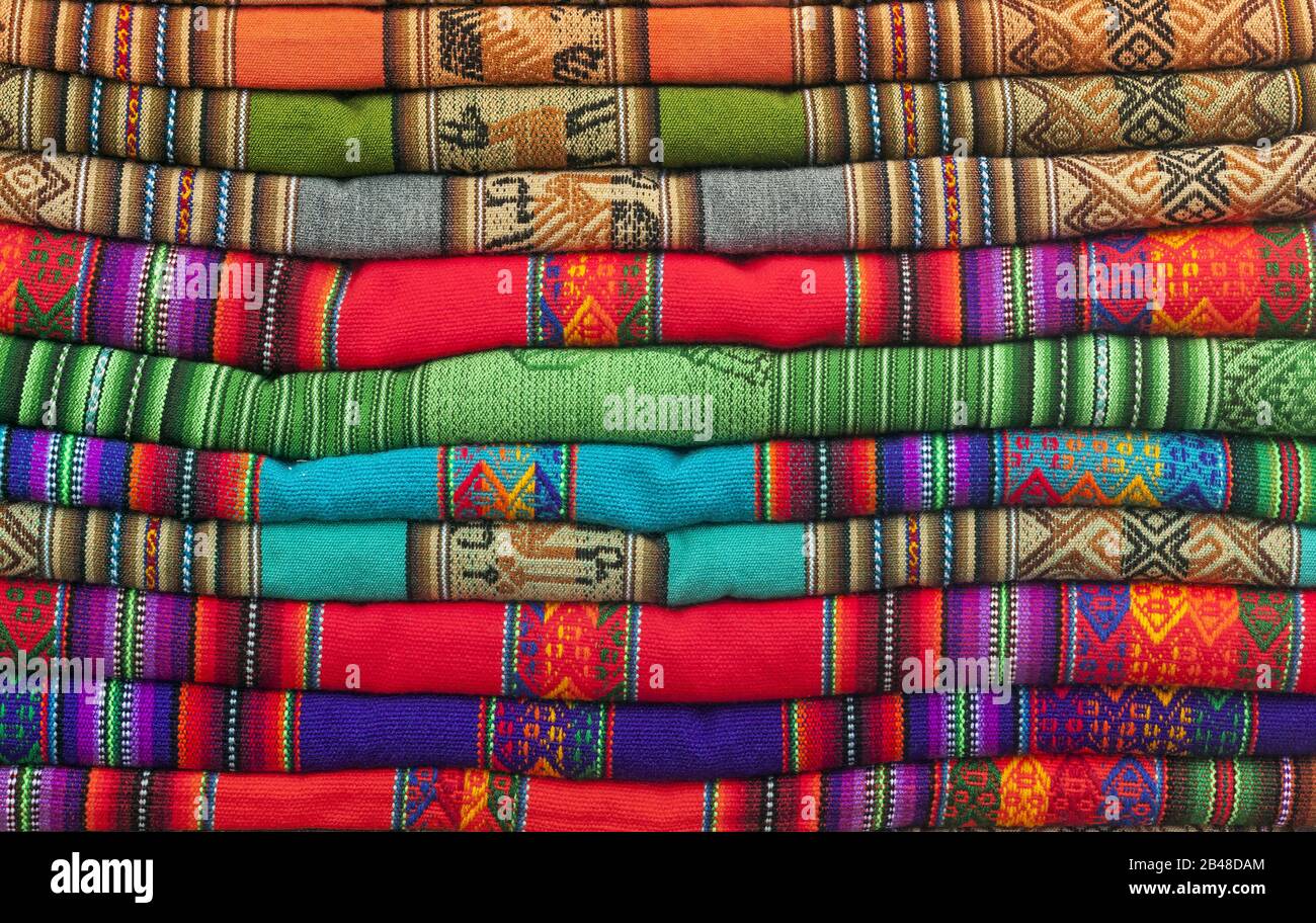A pile of colorful Andean textiles photographed in the local handicraft ...