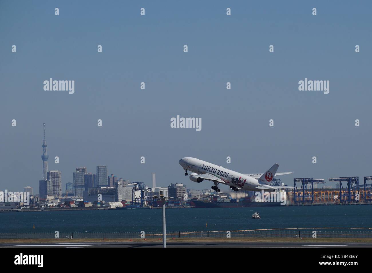 A JAL jet with Tokyo 2020 livery takes off from Haneda Airport in Tokyo ...