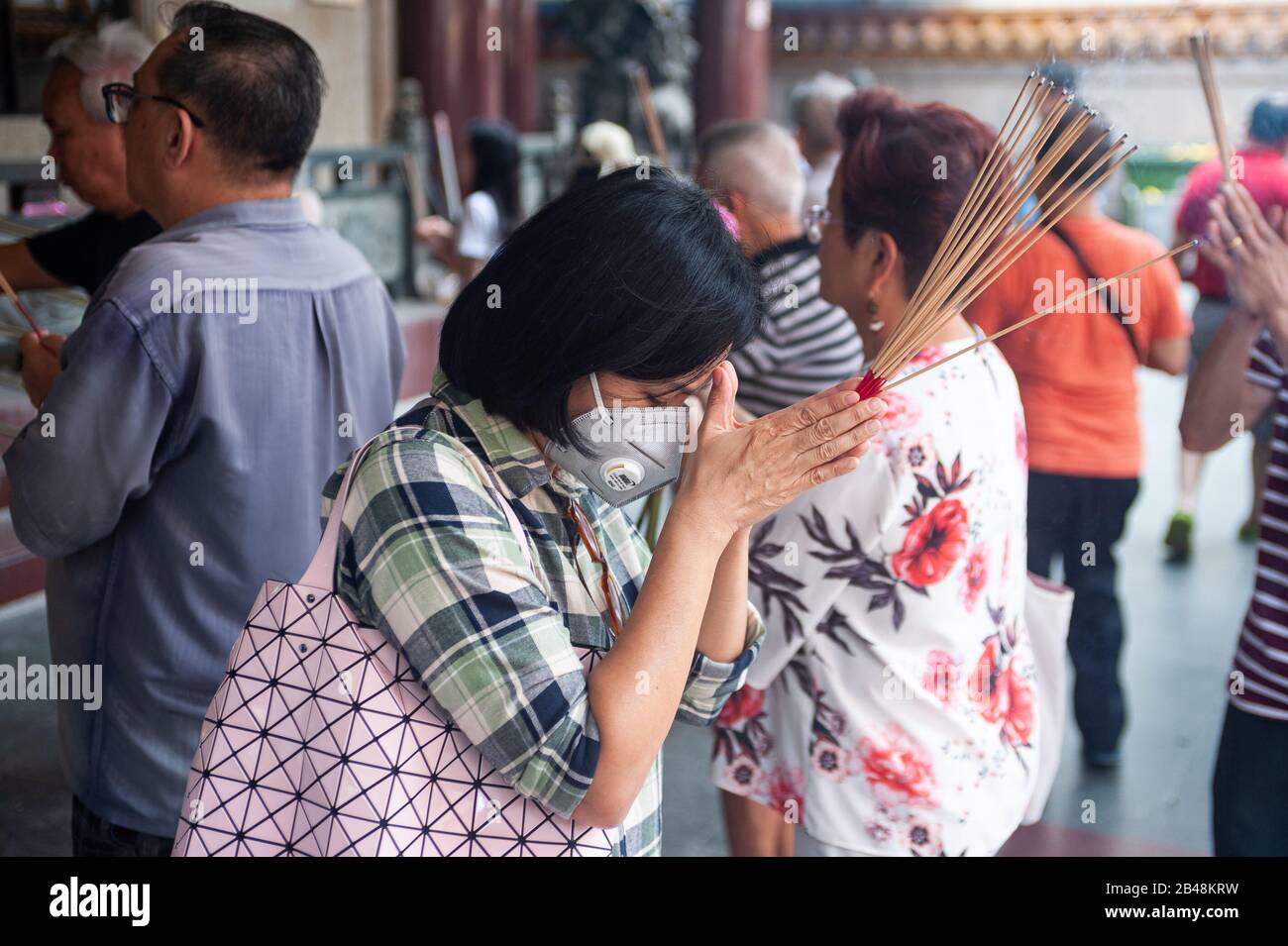 06.03.2020, Singapore, Republic of Singapore, Asia - Woman with face ...