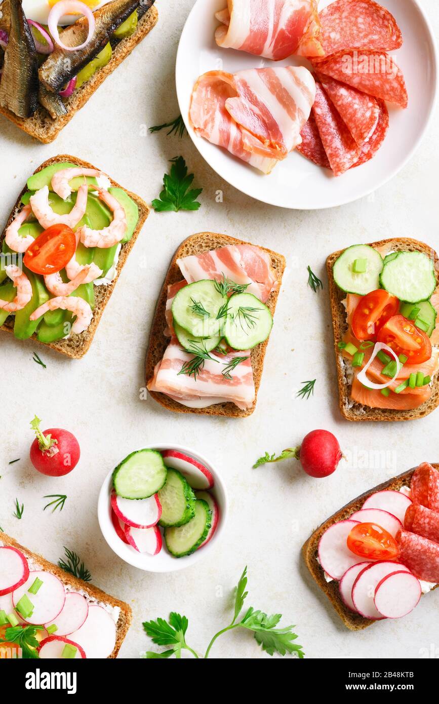 Different sandwiches with meat, vegetables, seafood. Assortment open ...