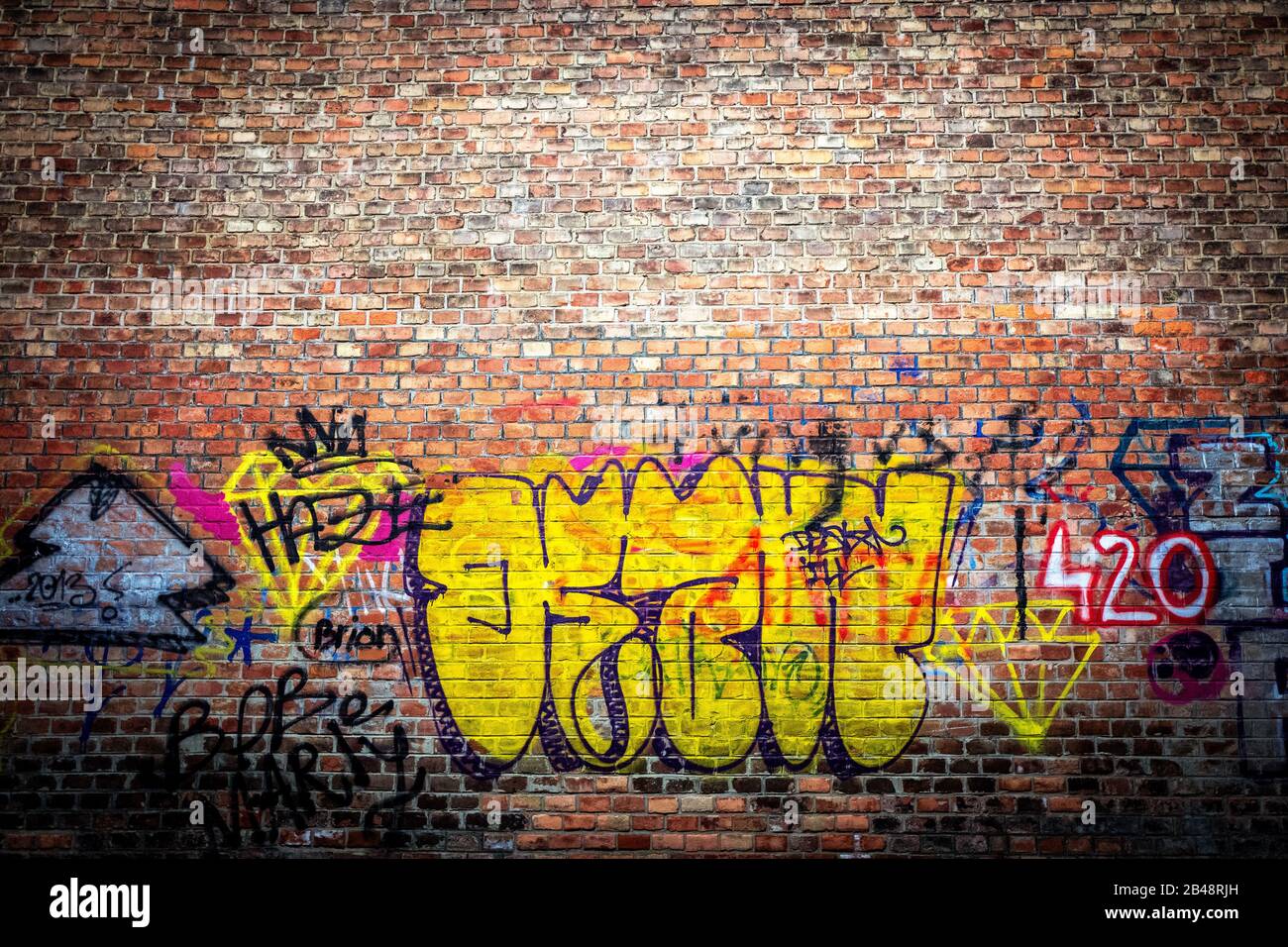 graffiti on a brick wall Stock Photo - Alamy