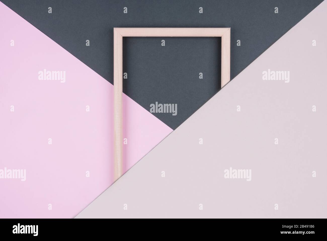 Wooden frame on a three color background Stock Photo - Alamy