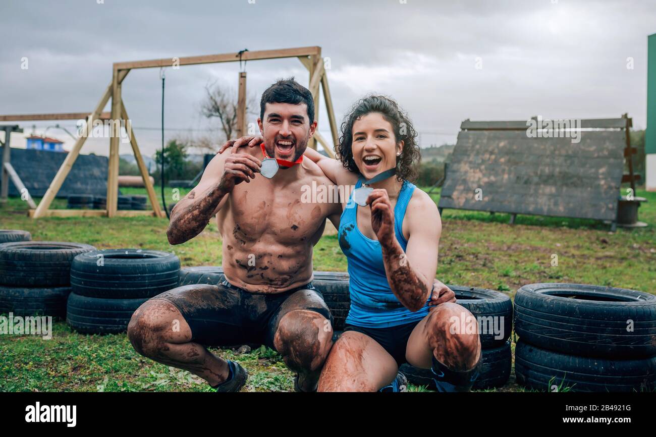 Athletes showing medals after race Stock Photo - Alamy