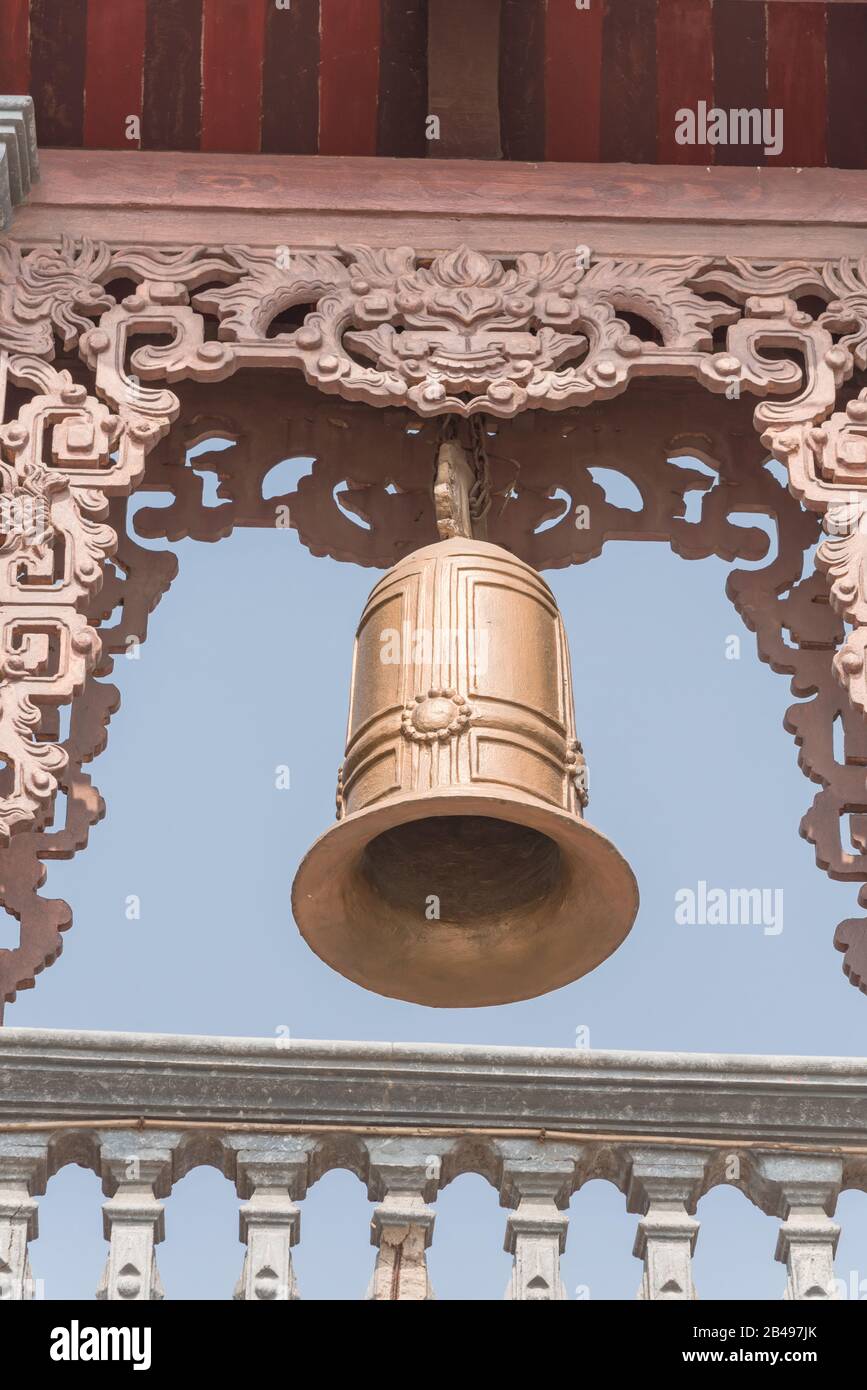 Typical bell tower outdoor instrument under clear blue sky in Vietnam ...