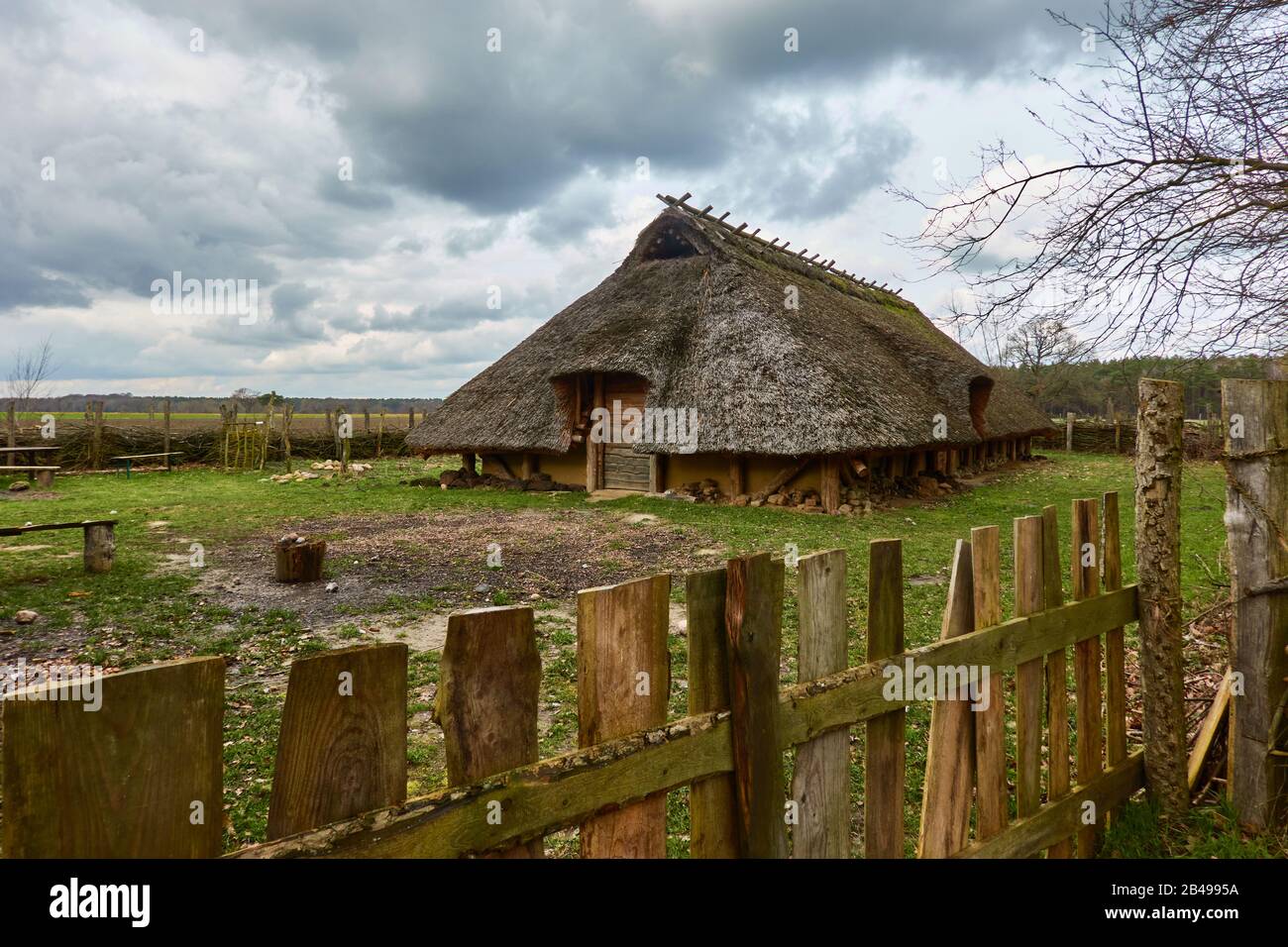 Historical traditional house with deep thatched roof Stock Photo - Alamy