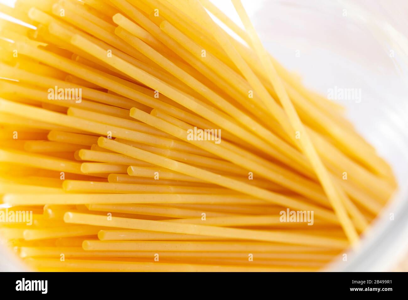 Beautiful raw spaghetti pasta background Stock Photo - Alamy
