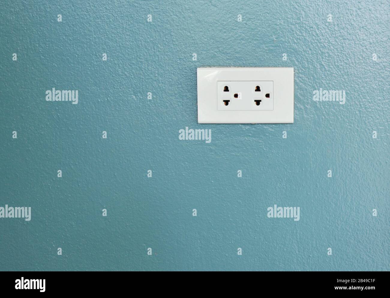white electric power outlet on home cement wall Stock Photo - Alamy